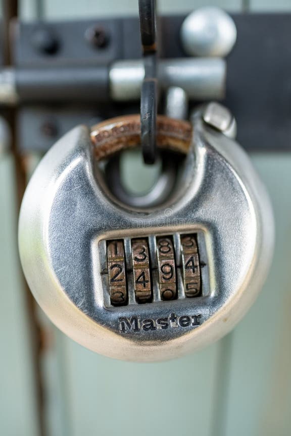 Vertical Closeup Shot of Rusty Metal Lock with Passcode Numbers Hung on ...