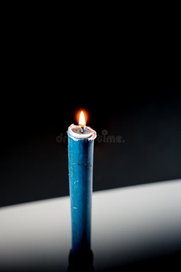 Vertical Closeup Shot of a Single Long Candle with a Burning Flame ...