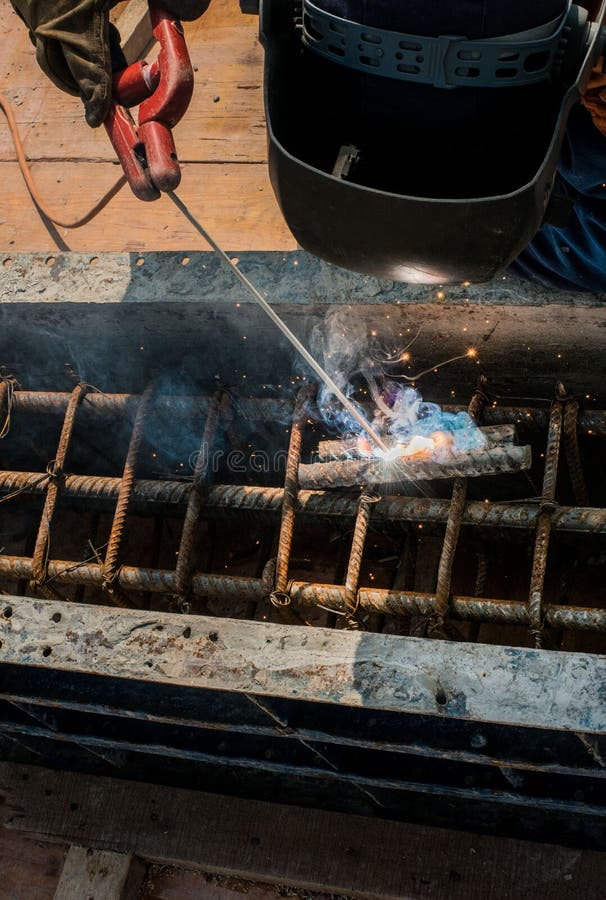 Worker in the Process of Railroad Track Weld Repair with a Freight ...