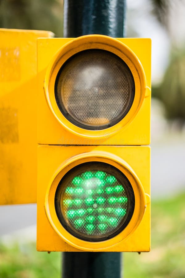Vertical Closeup Shot of a Yellow Traffic Light with an Illuminated ...