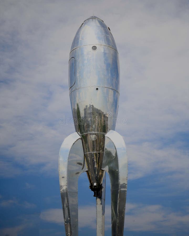 Vertical Closeup of a Silver Space Rocket in the Sky Near Another ...