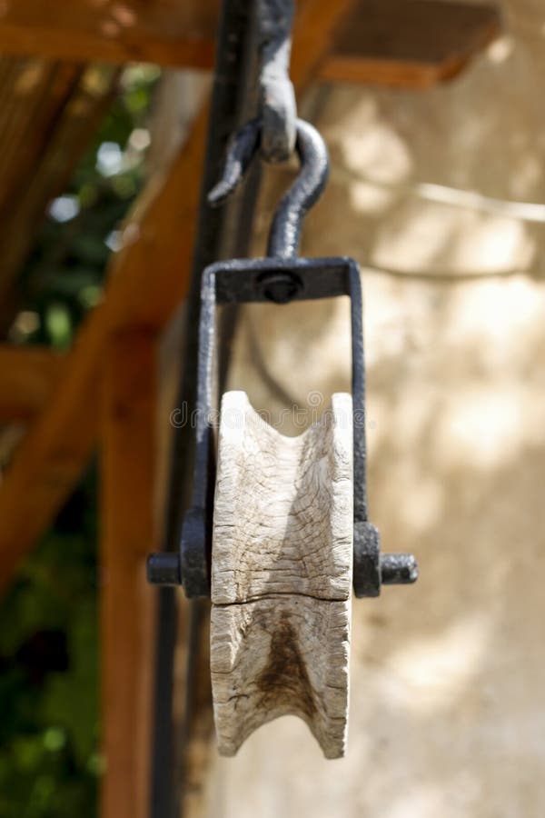 Vertical Closeup Wooden Pulley with a Rustic Hook on Top Stock Image ...