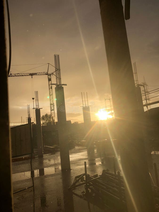 Vertical of Construction Process with Sun Shining on the Sky Stock ...