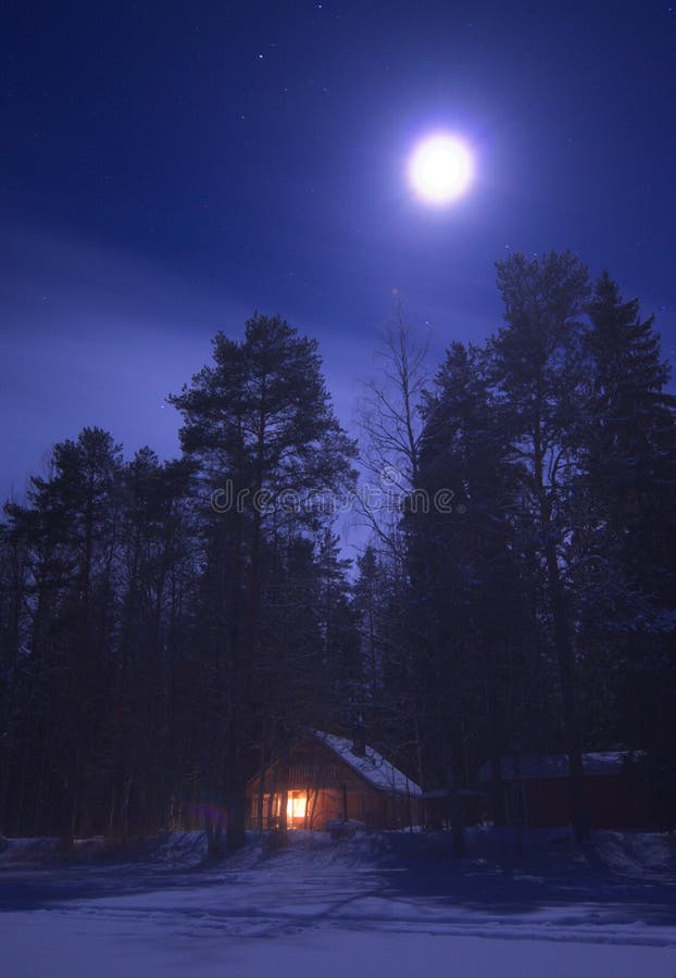 Vertical of a Cottage and the Bright Moon in a Forest at Night Stock ...
