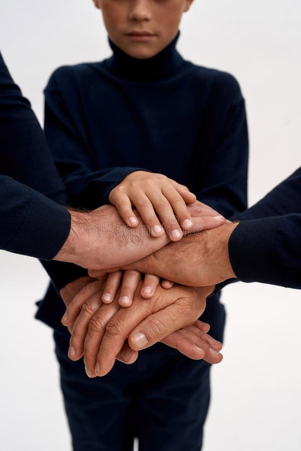 Vertical Crop Shot of Three Generations of Men Stack Hands Stock Photo ...