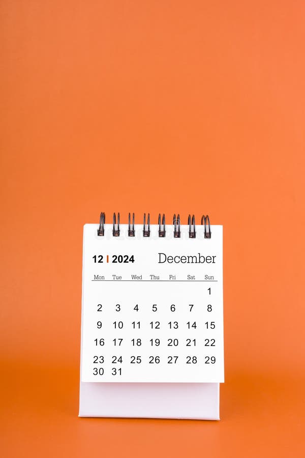 Vertical of December 2024 Table Calendar on Orange Background Stock ...