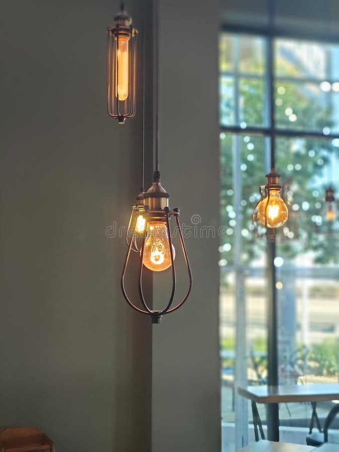 Vertical of Decorative Light Bulbs Hanging in a Cafe Stock Photo ...