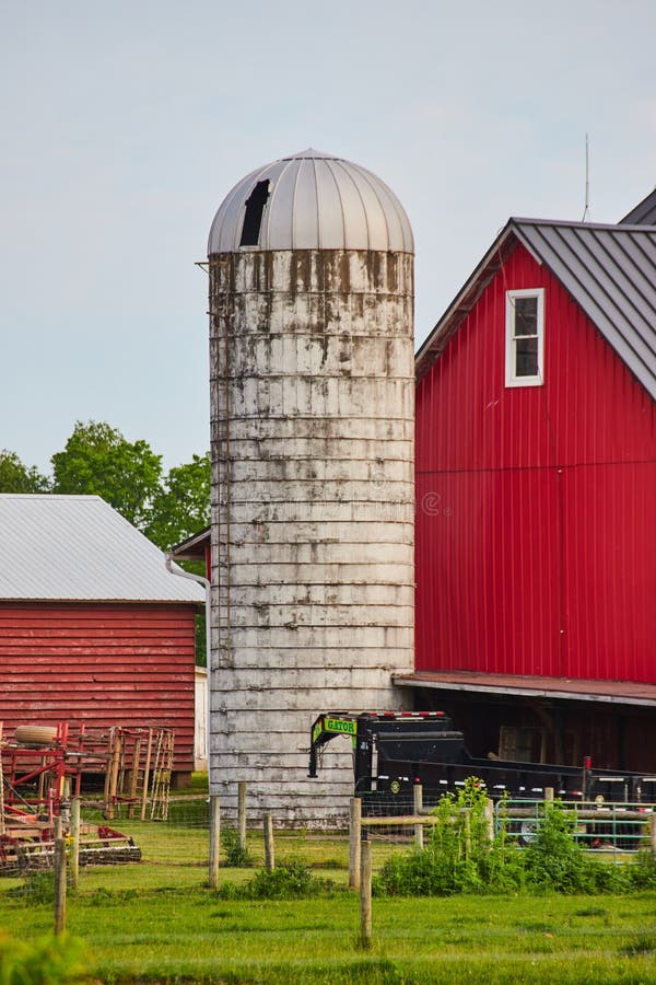 Vertical of Dirty White Silo Outside Pristine Red Barn Stock Image ...