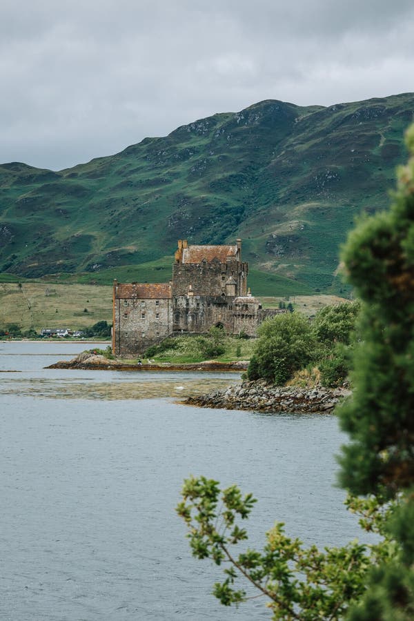 Vertical Distant View of the Eilean Donan Castle at the Coast of a ...