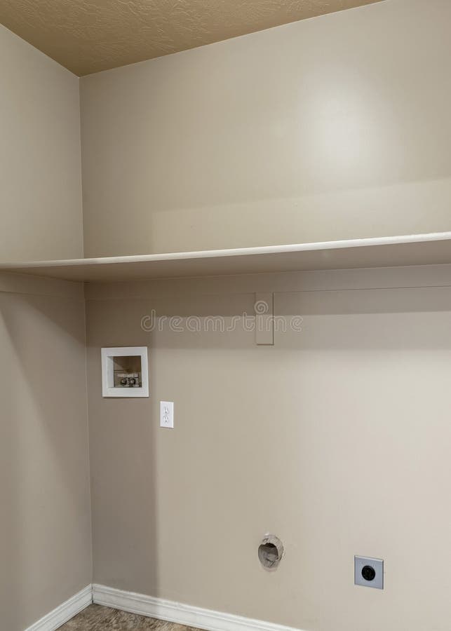 Vertical Empty Laundry Room Interior with Wall Mounted Shelf Stock ...