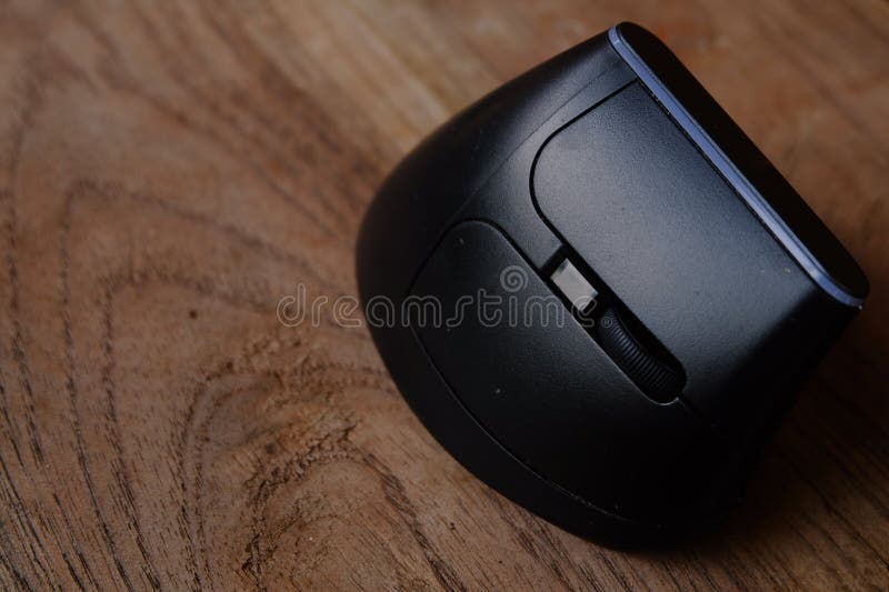 Vertical Ergonomic Wireless Mouse on Wooden Surface for Office or Home ...