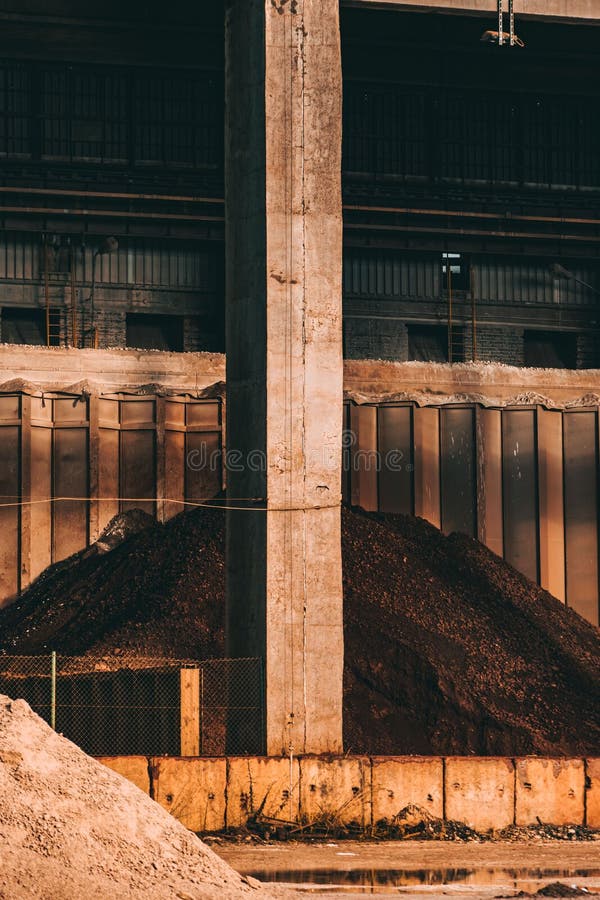 Vertical Footage of a Construction with a Pillar in the Front and a ...