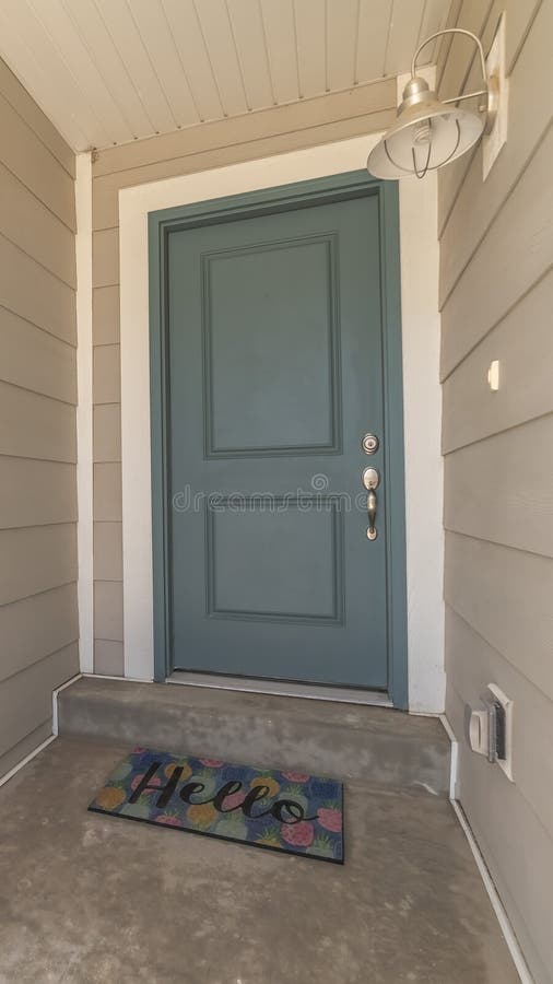 Vertical Frame Blue Wooden Front Door with Hello Welcome Mat Stock ...