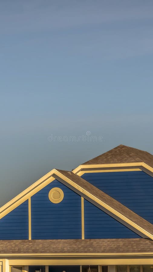 Vertical Frame Close Up of Roof Structure of Home with Blue Gable Wall ...