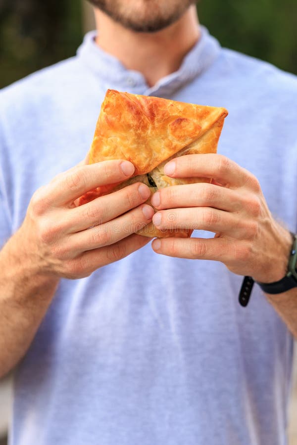 Vertical Frame of Hands Holding Pastries, Fast Food Snack Concept. Background with Selective ...