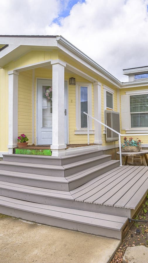 Vertical Frame Home Exetrior with Wrap Around Steps and Columns on the ...