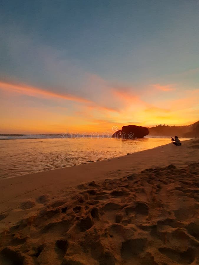 Vertical Full Length View through the Sandy Beach with Golden Sea Water ...