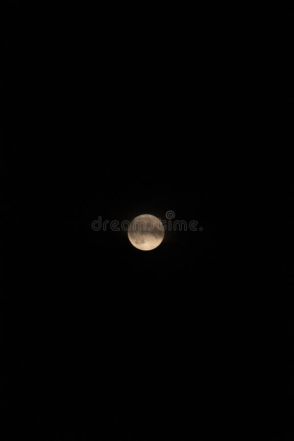 Vertical of a Full Moon Lunar Eclipse in the Black Sky Stock Image ...