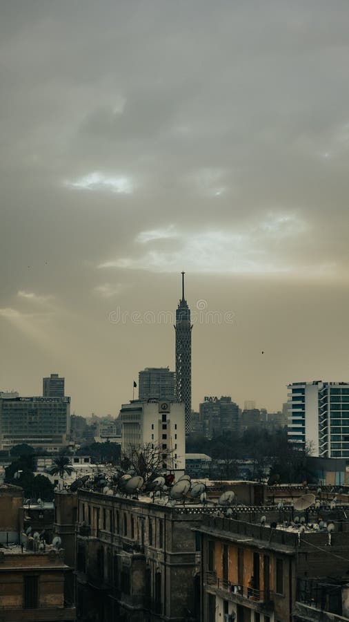 Vertical Gloomy Landscape of the Cairo Tower Peaking Behind the ...