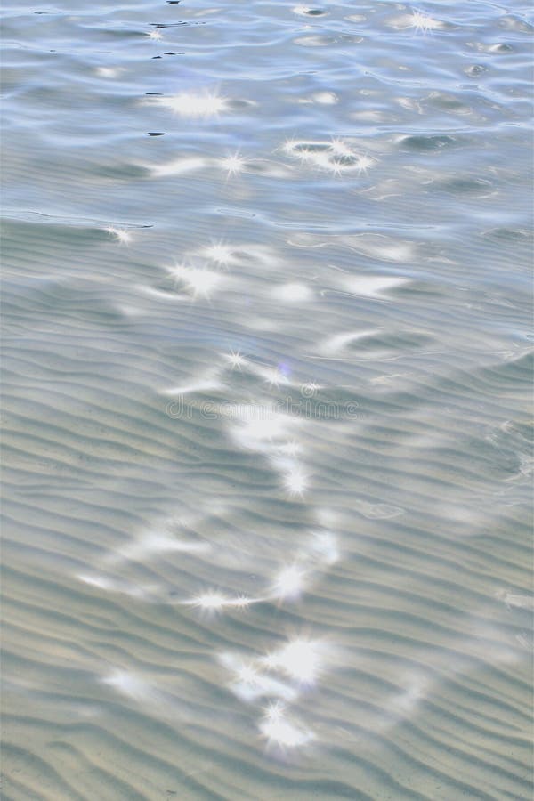 Vertical of the Golden Sunset Shining and Reflecting in the Calm Waters ...