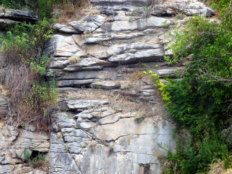 Vertical Granite Rock from Layered Granite Stones. Side View Stock ...