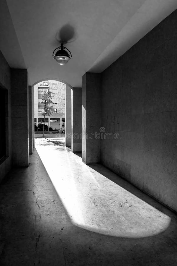 Vertical Gray Scale Shot of Shadow of Two People in the Street Stock ...