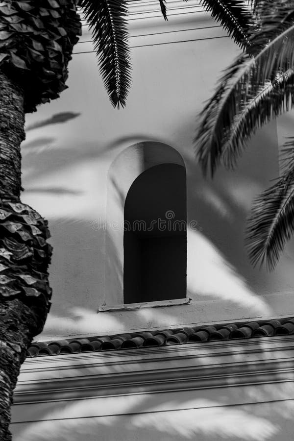 Vertical Grayscale of an Arched Window of a Building Stock Image ...