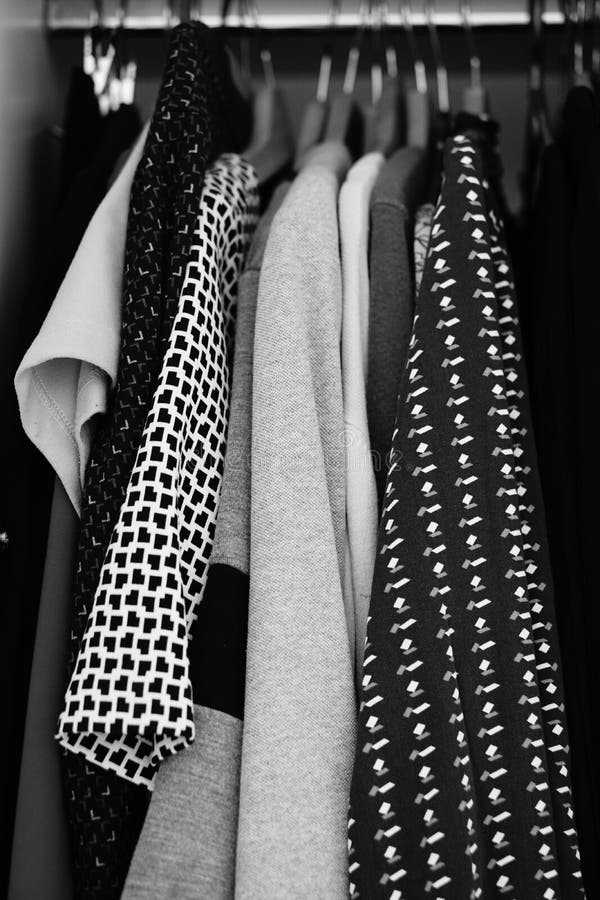 Vertical Grayscale Closeup of the Clothes in a Wardrobe. Stock ...