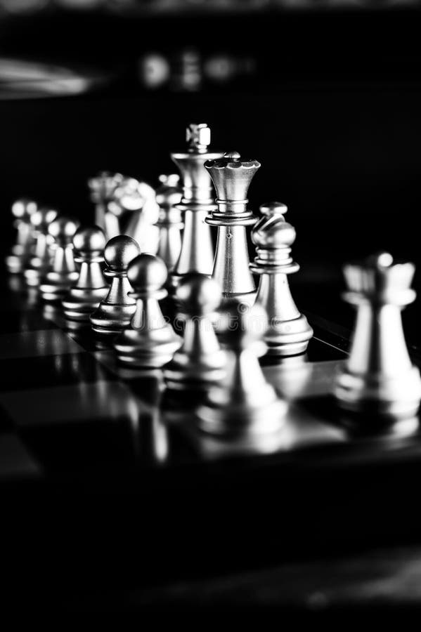 Vertical Grayscale High-angle Shot of a Chess Board with the Pieces on ...