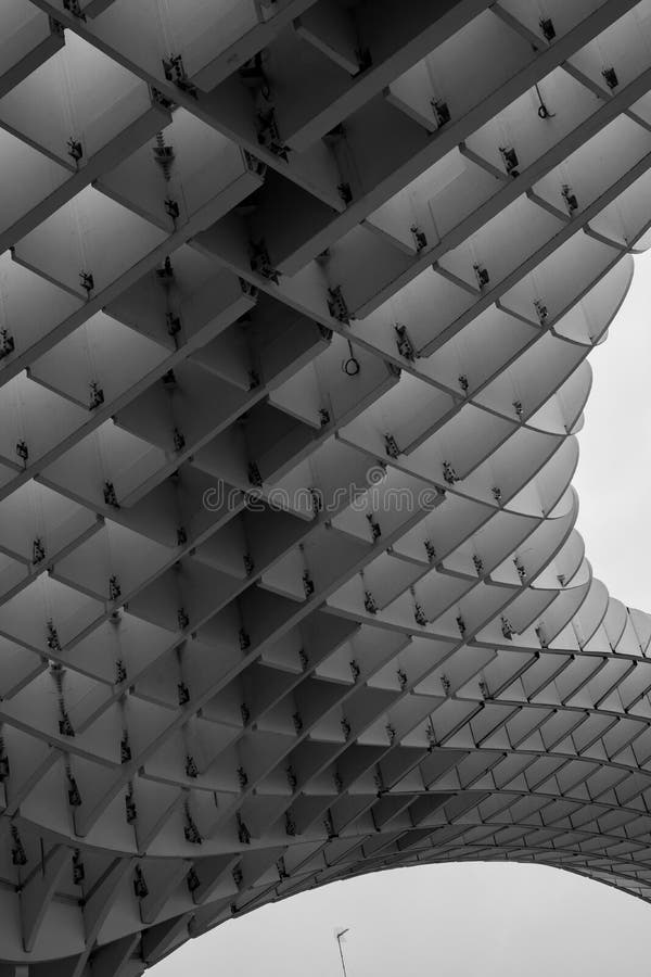Vertical Grayscale Shot of the Details of a Modern Architectural ...