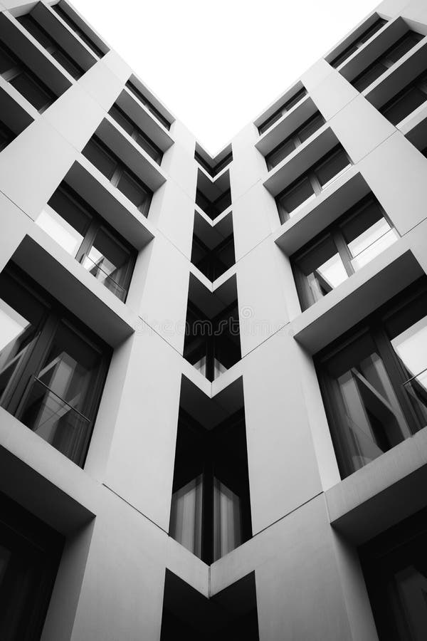 Vertical Grayscale Shot of a High-rise Building Stock Image - Image of ...