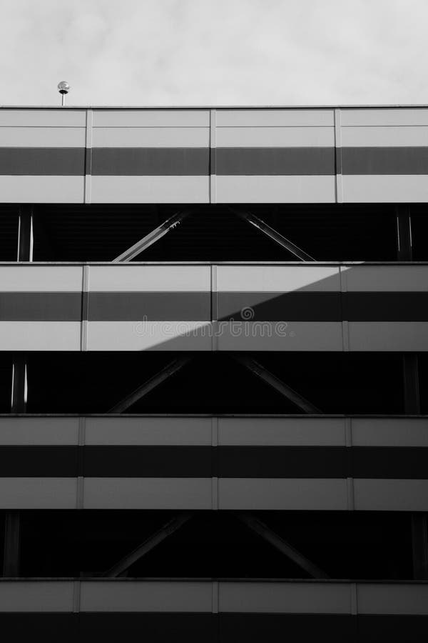 Vertical Grayscale Shot of a Modern Building S Exterior during Daylight ...