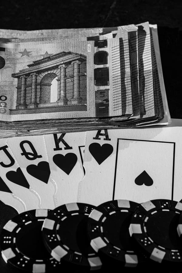 Vertical Grayscale Shot of Poker Chips, a Stack of Paper Bills and ...