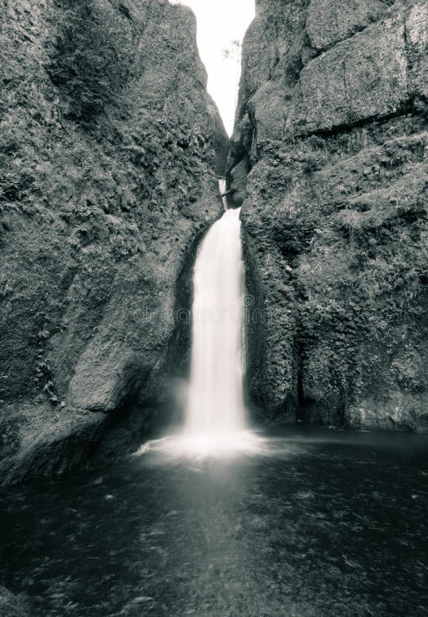 Vertical Grayscale Shot of a Strong Waterfall Flowing in the River ...