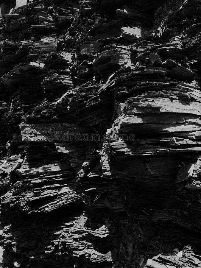 Vertical Grey Scale Shot of Beautiful Layers of Old Rocks Stock Photo ...