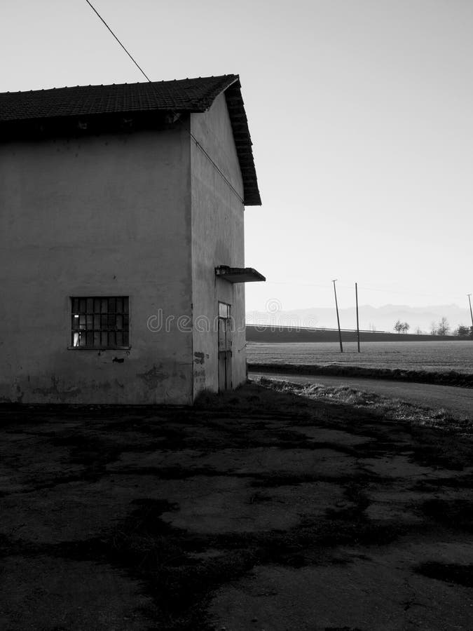 Vertical Grey Scale Shot of an Old House by a Road Stock Photo - Image ...