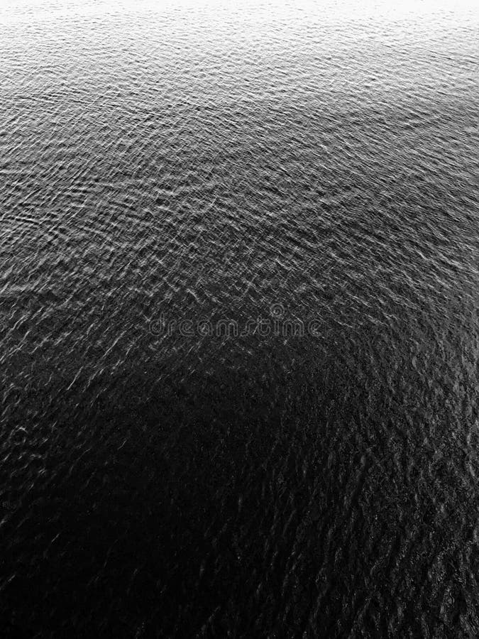 Vertical Grey Scale Shot of the Waves on the Ocean Captured from a High ...
