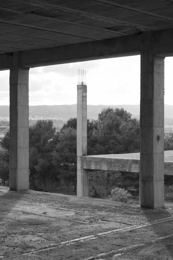 Vertical Greyscale Shot of Concrete Columns in a Construction Site ...