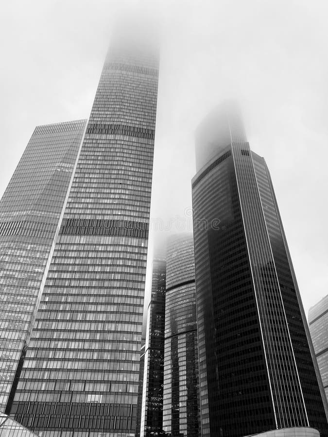 Vertical Greyscale Shot of High Rise Modern Business Buildings Stock ...