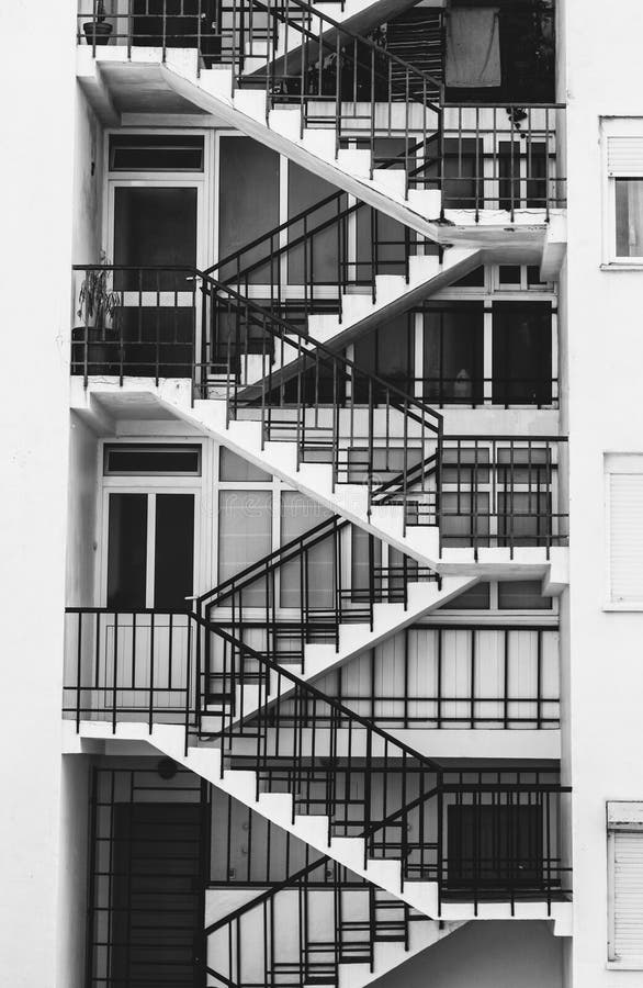 Vertical Greyscale Shot of a Modern Building with Straight Stairs Stock ...