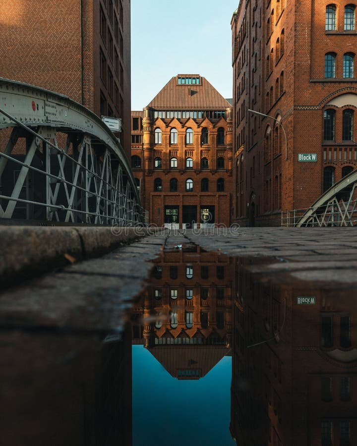 Vertical Ground Level Shot of a Bridge with Old Buildings in the ...