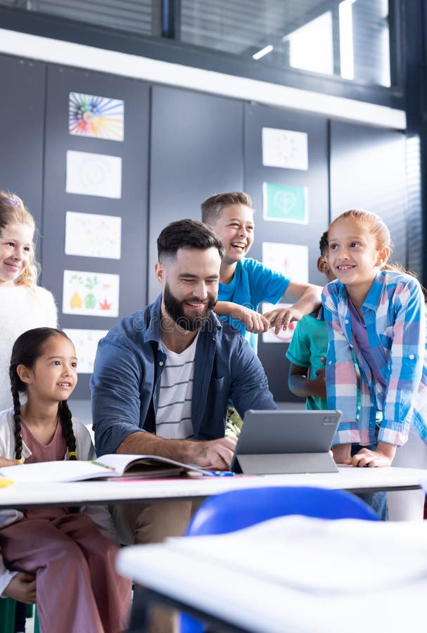 Vertical of Diverse Male Teacher Addressing Pupils in Elementary School ...