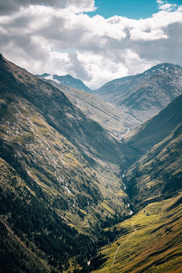 Vertical High-angle of Mountains with Valley View Sunlit, Cloudy Sky ...