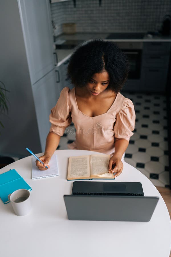 Vertical High-angle Shot of Clever African Female Student Sitting at ...