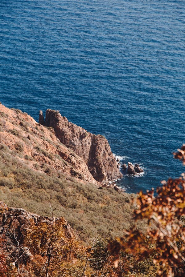 Vertical High Angle Shot of Cliffs by the Sea Captured on a Bright ...