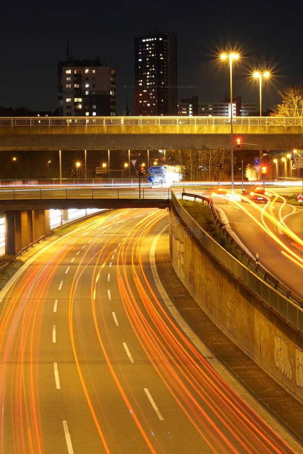 Vertical High Angle Shot of an Illuminated Highway at Night Stock Photo ...