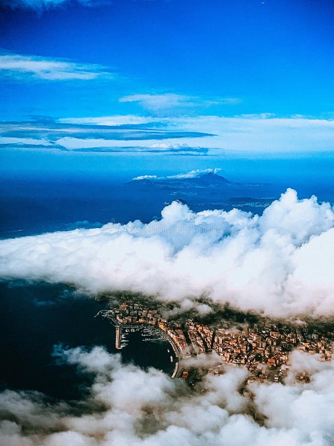 Vertical High Angle Shot of an Island by the Ocean Visible through the ...