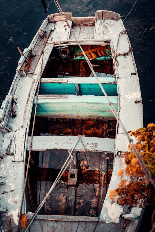 Vertical High Angle Shot of an Old White Boat on the Water Stock Photo ...