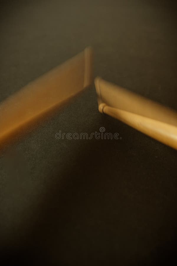 Vertical High Angle Shot of a Pair of Drum Sticks Drumming on a Black ...