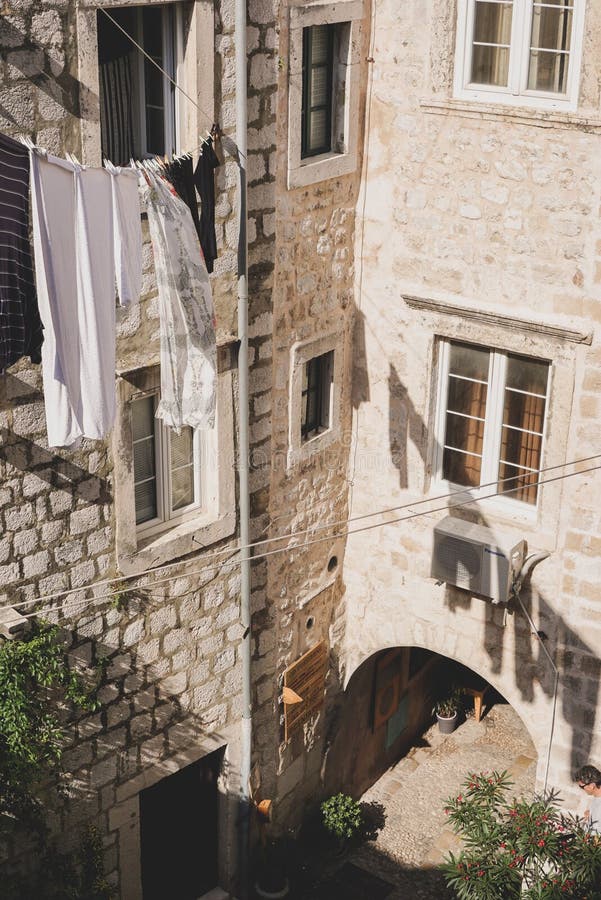 Vertical High-angle Shot of a Residential Building Yard and Laundry ...